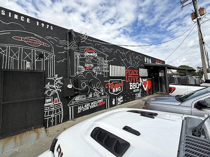 The black exterior with white chalk-style art isn't just Instagram bait—it's a barbecue bat signal calling hungry Floridians to smoky paradise.