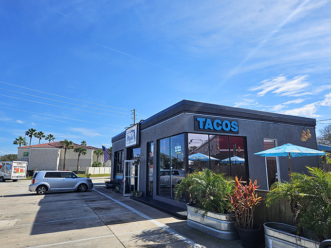 The unassuming exterior of Mojo's Tacos stands like a flavor fortress in St. Augustine, promising culinary treasures behind that simple "TACOS" sign.