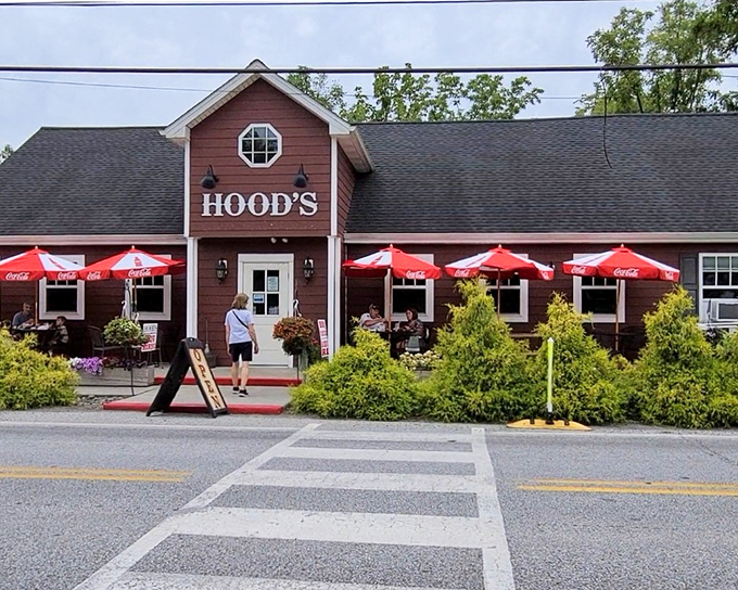 Hood's BBQ stands proud in Kennett Square, its barn-red exterior and welcoming entrance promising smoky delights within. The landscaping adds a touch of charm that says "come on in, hungry traveler."