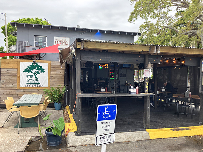 The unassuming blue exterior of The Tavern at Bayboro stands like a culinary speakeasy, promising authentic flavors without the fanfare of trendier establishments.