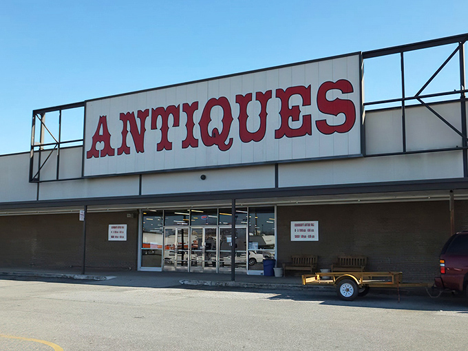 The red "ANTIQUES" sign beckons like a siren call to treasure hunters. No fancy frills needed when what's inside speaks volumes.