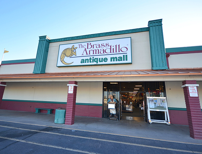 The unassuming exterior hides a universe of treasures within. Like a time-travel portal disguised as a strip mall storefront, the Brass Armadillo beckons.