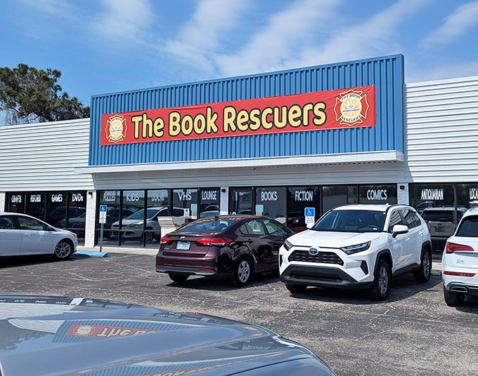 The blue storefront with its bold red banner announces its mission like a literary superhero's headquarters. Books, not capes, save the day here. 