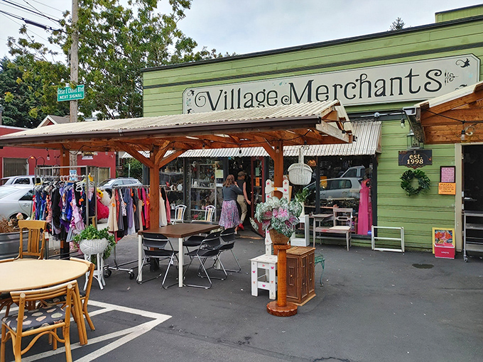 The iconic blue sign of Village Merchants beckons treasure hunters to this Portland paradise where outdoor displays offer a tantalizing preview of the wonders within.