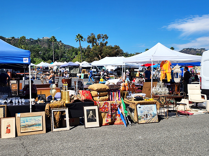 Treasure hunting paradise under the California sun. White tents stretch across the asphalt, offering everything from vintage frames to glassware and colorful textiles.