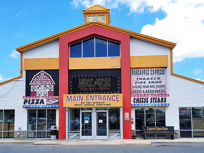 The rainbow-colored exterior of Laurel Junction beckons like a carnival barker promising treasures inside. Bold primary colors and straightforward signage set expectations: adventure awaits.