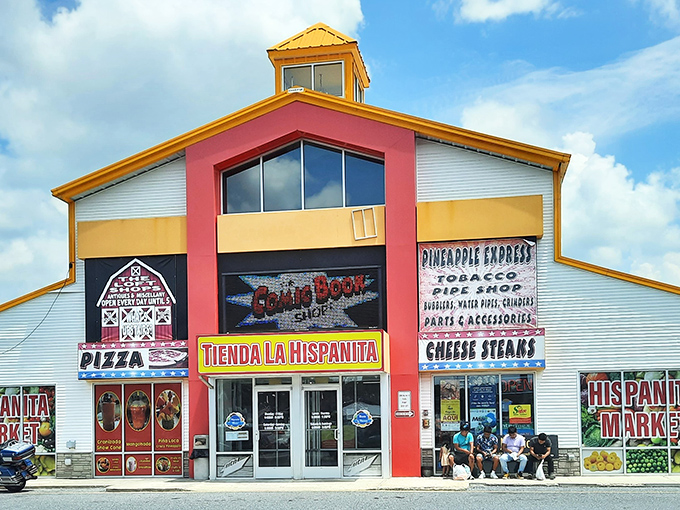 The vibrant red and yellow facade of Laurel Junction beckons like a carnival barker promising treasures within. Delaware's bargain-hunting paradise awaits!