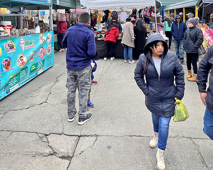 Glass display cases become treasure chests at Durham Green Flea Market, where shoppers hunt for collectibles while colorful pi&ntilde;atas stand guard overhead.