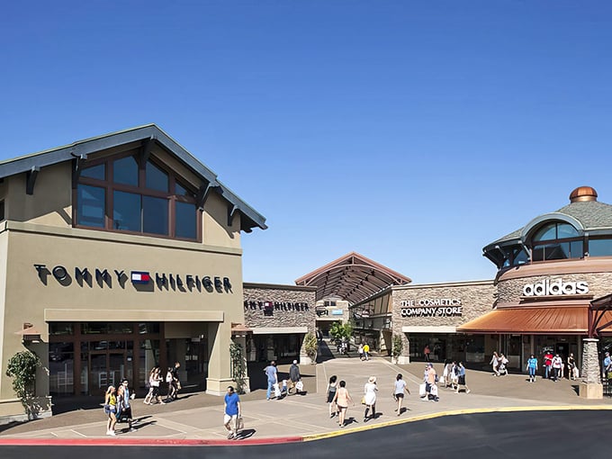 The Northwest-inspired architecture of Woodburn Premium Outlets welcomes shoppers with its distinctive peaked roofs and stone facades&mdash;retail therapy with a touch of mountain lodge aesthetic.