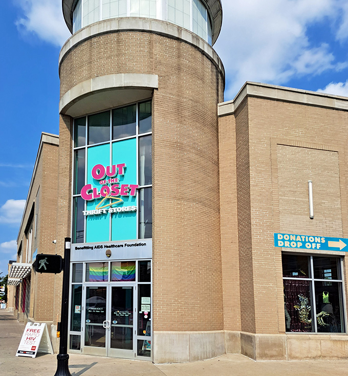 The iconic turquoise and pink signage of Out of the Closet stands as a beacon for bargain hunters and do-gooders alike in Columbus's Short North district.