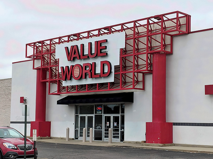 The iconic red framework of Value World stands like a portal to treasure hunting adventures, beckoning bargain seekers from across Michigan.