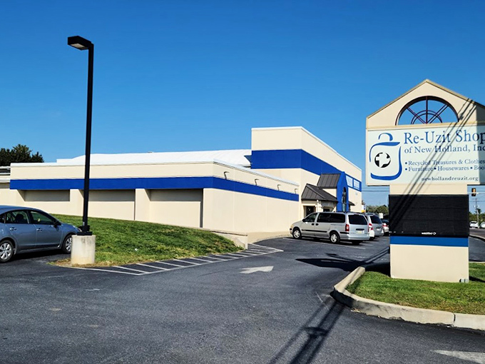 The blue-trimmed exterior of Re-Uzit Shop stands like a temple to thrift, promising treasures inside that'll make your wallet sing with joy.