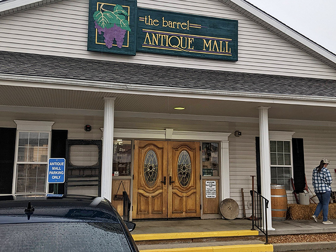 The welcoming facade of The Barrel Antique Mall beckons with its charming porch and elegant wooden doors&mdash;a modest exterior that belies the wonderland within.