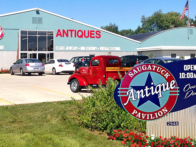 The mint-green beacon of vintage treasures stands proudly along Blue Star Highway, promising adventures through time rather than just shopping.