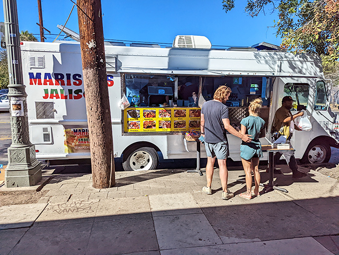 The unassuming white truck with bold red and green lettering houses culinary treasures that have locals lining up daily. Seafood nirvana awaits!
