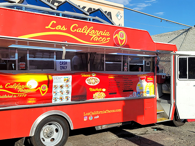 The bright red beacon of Los California Tacos stands proudly outside Nishikawa Auto Service, proving that culinary magic can happen in the most unexpected places.