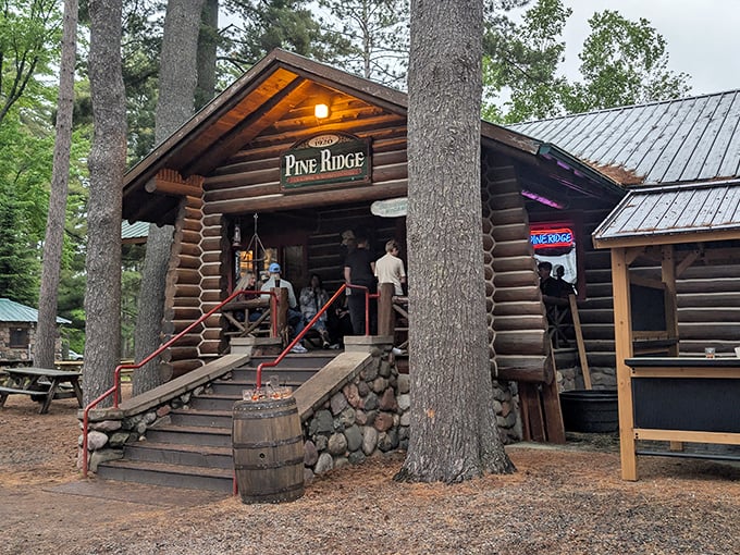 The quintessential Northwoods hideaway beckons through towering pines. This log cabin promises culinary treasures worth every mile of your journey.