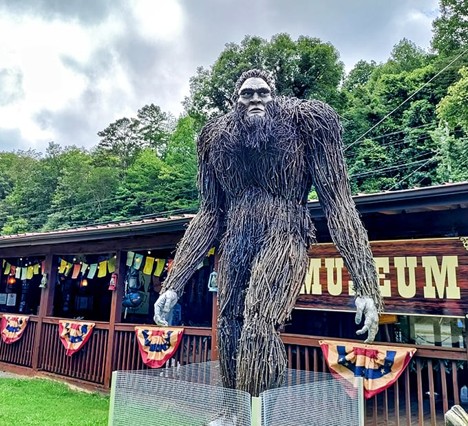 The guardian of cryptid knowledge stands tall outside EXPEDITION! Museum. Those prayer flags aren't just for show&mdash;they're Sasquatch's laundry line.