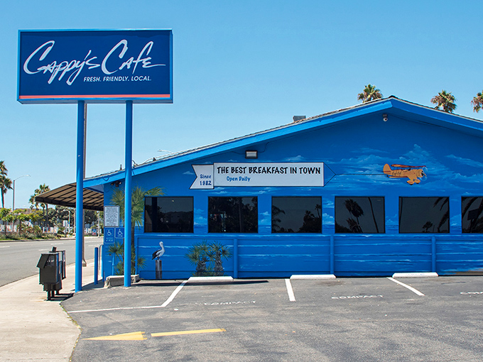 The iconic blue exterior of Cappy's Caf&eacute; stands out like a beacon of breakfast hope on Newport Beach's coastline.