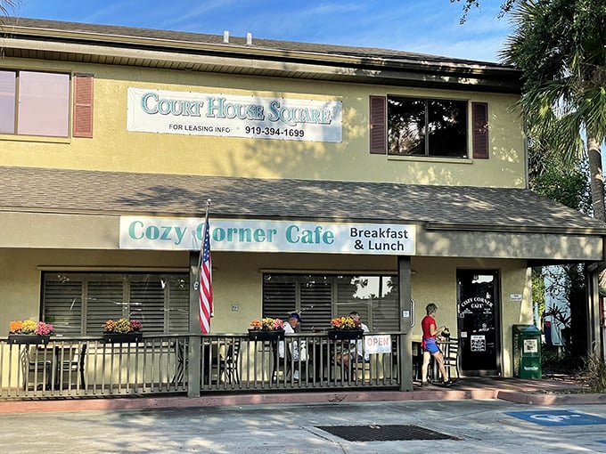 The yellow facade of Cozy Corner Cafe stands like a beacon of breakfast hope in Merritt Island's Court House Square, promising comfort food and conversation.