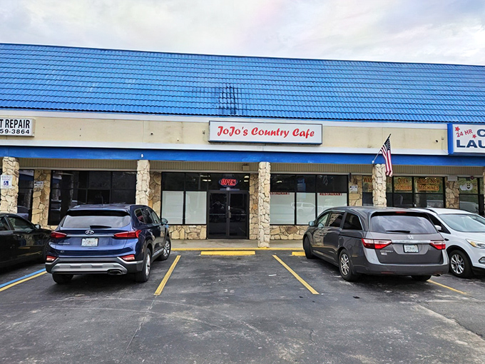 The blue roof beckons like a Florida sky, promising comfort beneath. JoJo's Country Cafe sits unassumingly in this Deltona strip mall, a hidden breakfast treasure waiting to be discovered.