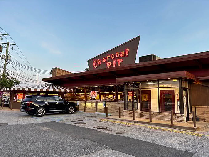 The angular roof of Charcoal Pit rises from Concord Pike like a mid-century beacon, promising comfort food salvation to hungry Delawareans since the Eisenhower era.