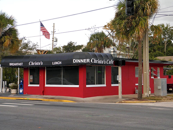 The unmistakable red exterior of Christo's Caf&eacute; stands out like a culinary lighthouse, beckoning hungry travelers with promises of breakfast bliss in Orlando.