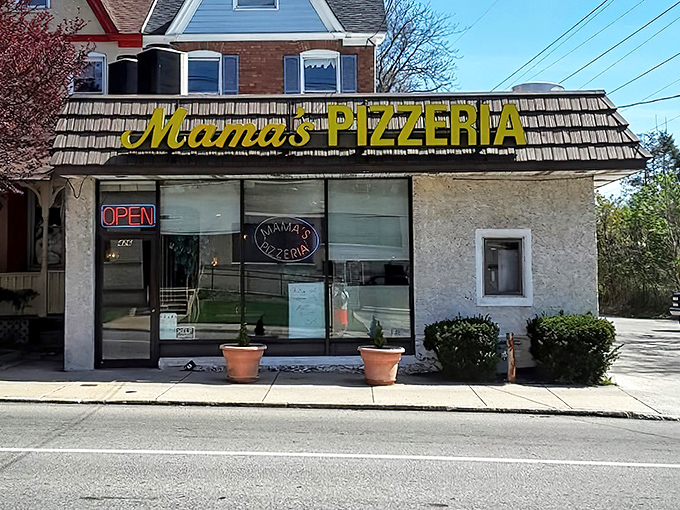 The unassuming yellow sign of Mama's Pizzeria stands as a beacon for sandwich aficionados, promising delicious treasures within those modest walls.