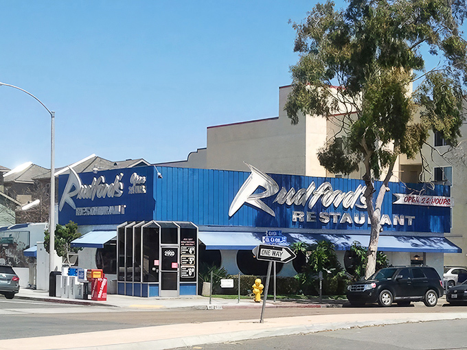 The unmistakable blue facade of Rudford's stands like a culinary lighthouse on El Cajon Boulevard, promising 24/7 salvation for the hungry souls of San Diego.