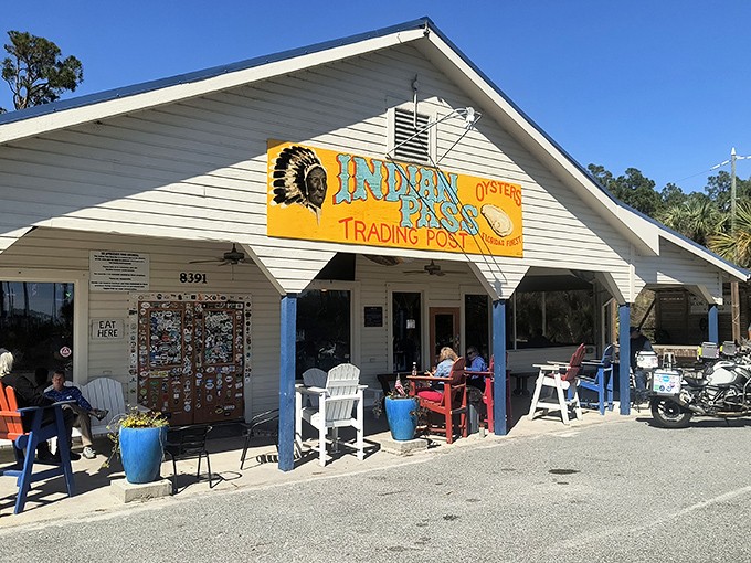 The unassuming exterior of Indian Pass Raw Bar, with its vibrant yellow sign and blue-trimmed porch, offers the first hint that you've found Florida's authentic seafood haven.