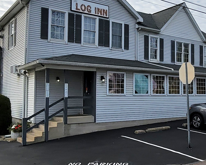 The unassuming white clapboard exterior of The Log Inn hides a culinary time machine. History and ham steaks await behind those doors!