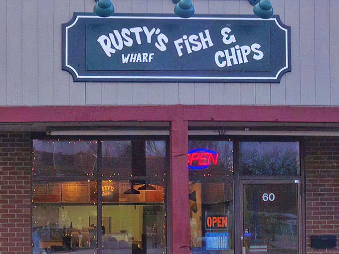 The unassuming storefront of Rusty's Wharf beckons with its no-frills charm and glowing "OPEN" sign&mdash;proof that seafood treasures often hide in plain sight.