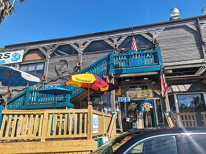 The weathered wooden exterior with bright blue railings isn't trying too hard&mdash;it's Florida authenticity that can't be manufactured or franchised.