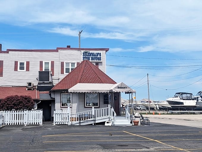 Brennan's Fish House stands proudly with its distinctive red-roofed gazebo entrance, like a lighthouse beckoning hungry seafood lovers to safe harbor.