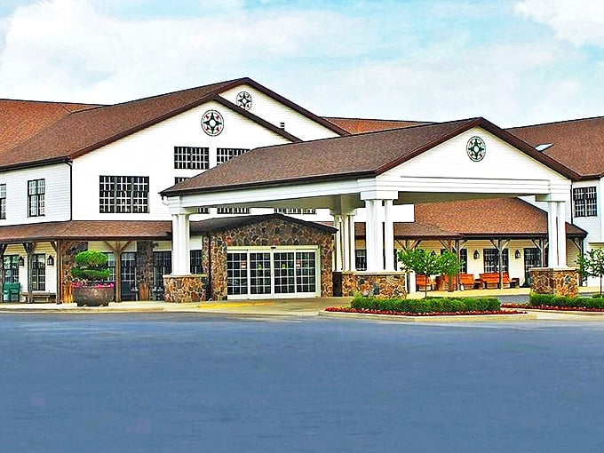 The iconic yellow exterior of Das Dutchman Essenhaus stands like a beacon of comfort food in Middlebury, promising Amish cooking that'll make your cardiologist weep and your soul sing.