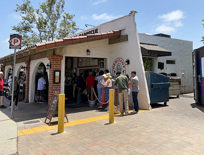 The pilgrimage begins here: Heritage Barbecue's modest Spanish-style exterior belies the smoky treasures within. Yellow bollards guide the faithful.