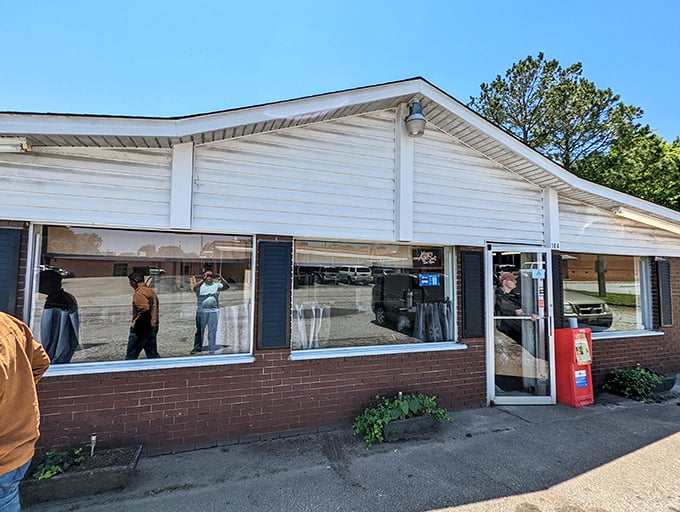The yellow sign says it all &ndash; this unassuming brick building houses burger magic that locals have treasured for decades.