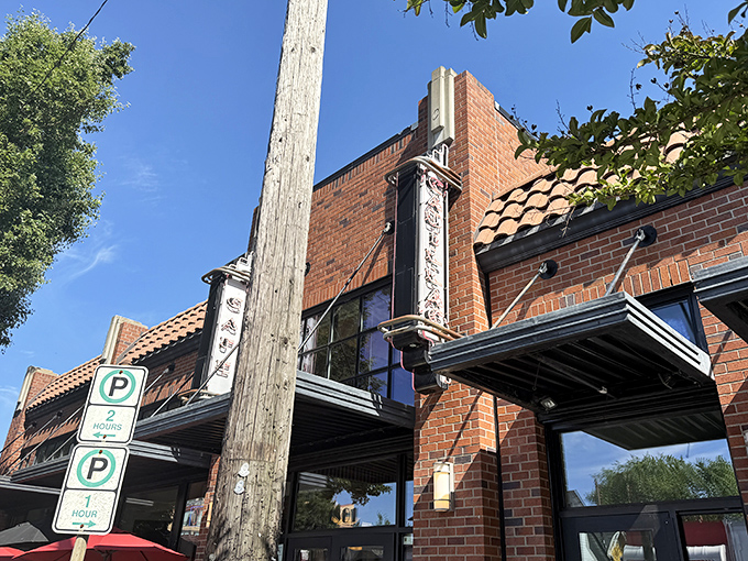 The brick façade of Cadillac Café stands proudly on a sunny Portland day, promising breakfast delights behind those welcoming doors.