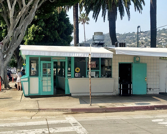This turquoise treasure on Milpas Street proves that culinary gold often hides behind humble facades. 