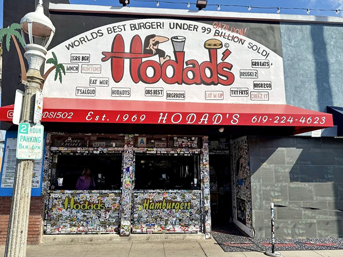 The iconic Hodad's storefront proudly declares "World's Best Burger!" with tongue-in-cheek modesty: "Under 99 Billion Sold!" Pure San Diego surf culture.
