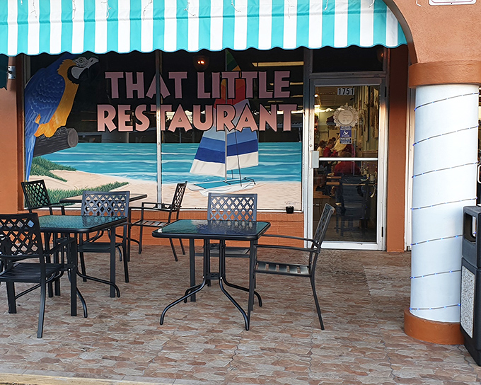 The turquoise-striped awning and tropical mural say "Florida" louder than a sunburned tourist asking for directions to the beach.