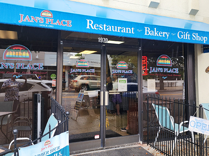 The bright blue awning of Jan's Place beckons like a breakfast lighthouse amid Jensen Beach's morning bustle. Outdoor seating for the brave Florida summer warriors.