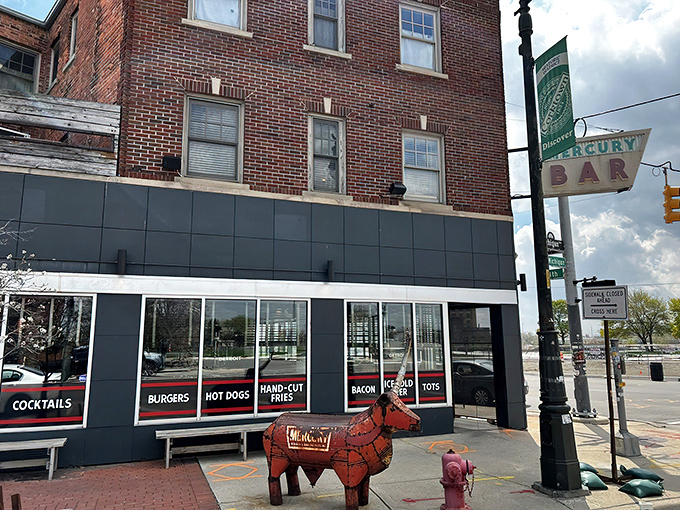 Detroit's Corktown neighborhood hides this brick-clad treasure with its iconic vintage sign and whimsical red bull sculpture. Burgers await inside!