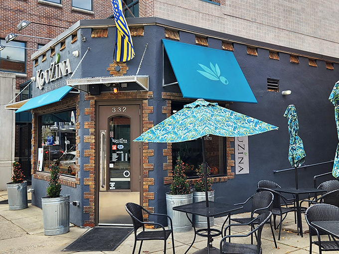 KouZina's distinctive blue awnings and brick-accented facade stand out on Royal Oak's Main Street like a Mediterranean beacon calling hungry travelers home.