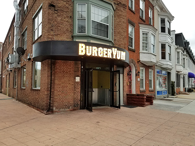 That marquee sign isn't just illuminated&mdash;it's making a promise your taste buds will thank you for keeping. Corner charm at its finest.