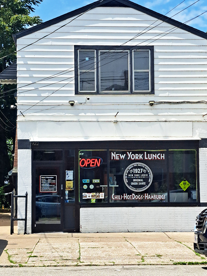 The unassuming storefront of New York Lunch belies the culinary treasures within. That neon "OPEN" sign might as well say "Food Paradise Ahead."