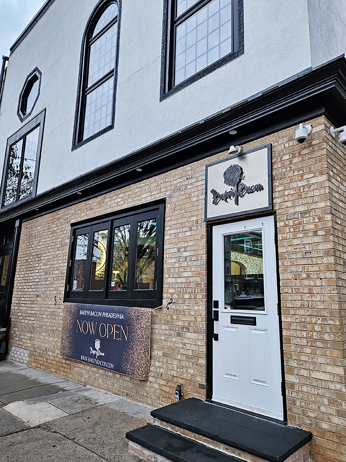 The unassuming brick exterior hides Philadelphia's pork paradise like a culinary speakeasy. Those planters aren't just pretty&mdash;they're guarding the gateway to flavor town.