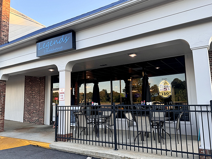 The blue neon sign beckons like a lighthouse for the hungry, promising legendary steaks behind those welcoming windows. Newberry's worst-kept culinary secret.