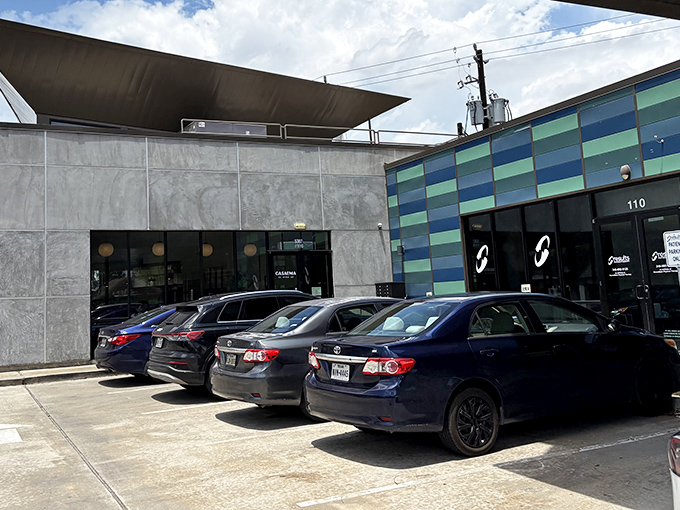 Modern meets Mexican at CasaEma's striking exterior, where the blue-green tiled facade hints at the culinary creativity waiting inside. No sombreros on the wall here, folks.