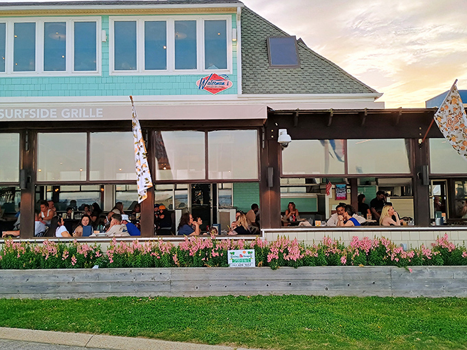 The aqua-colored exterior of Waterman's stands like a coastal beacon, promising seafood treasures within its unassuming beach house fa&ccedil;ade.